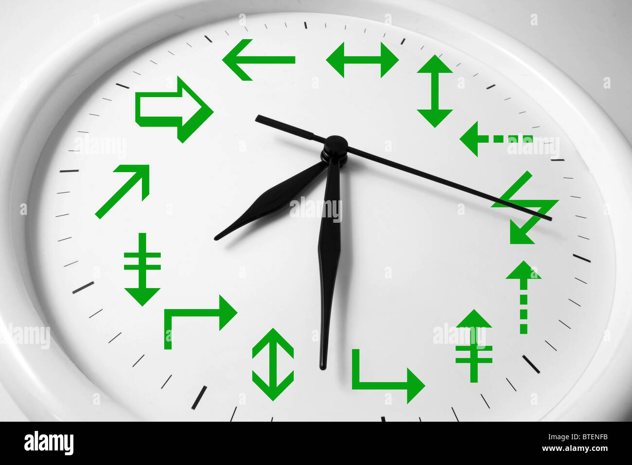 Clock with Arrows Stock Photo - Alamy