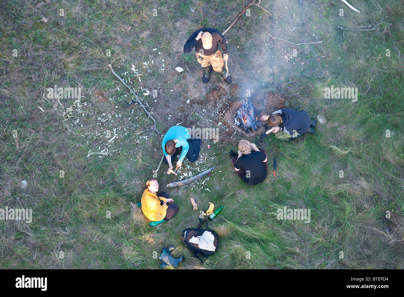 People around campfire Stock Photo - Alamy