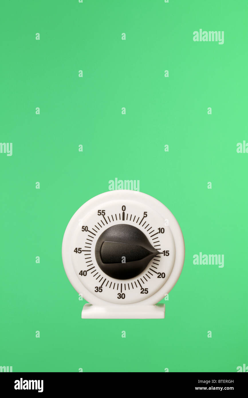 A count down timing device floating on a green background Stock Photo ...