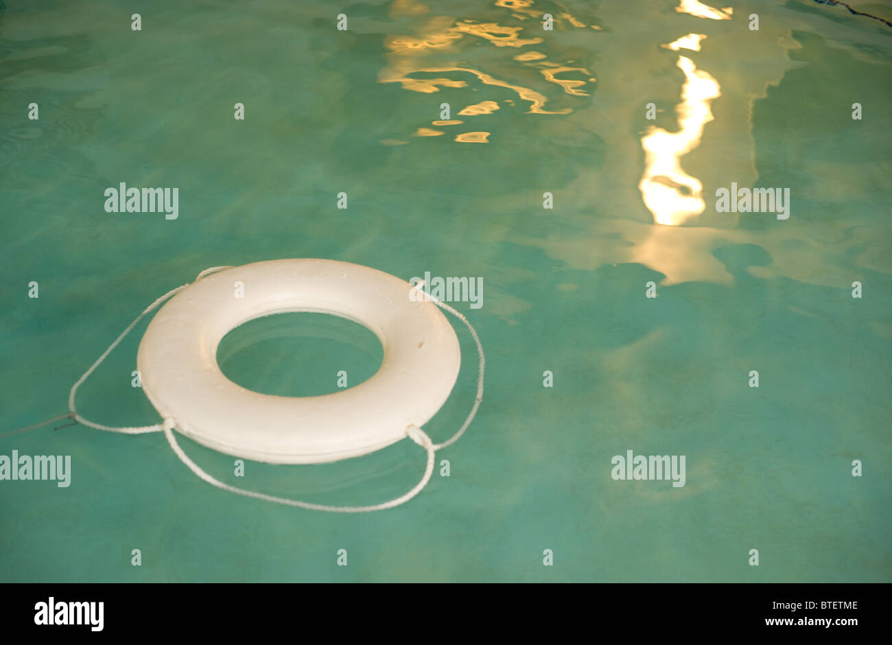 A life preserver floats in the swimming pool Stock Photo - Alamy