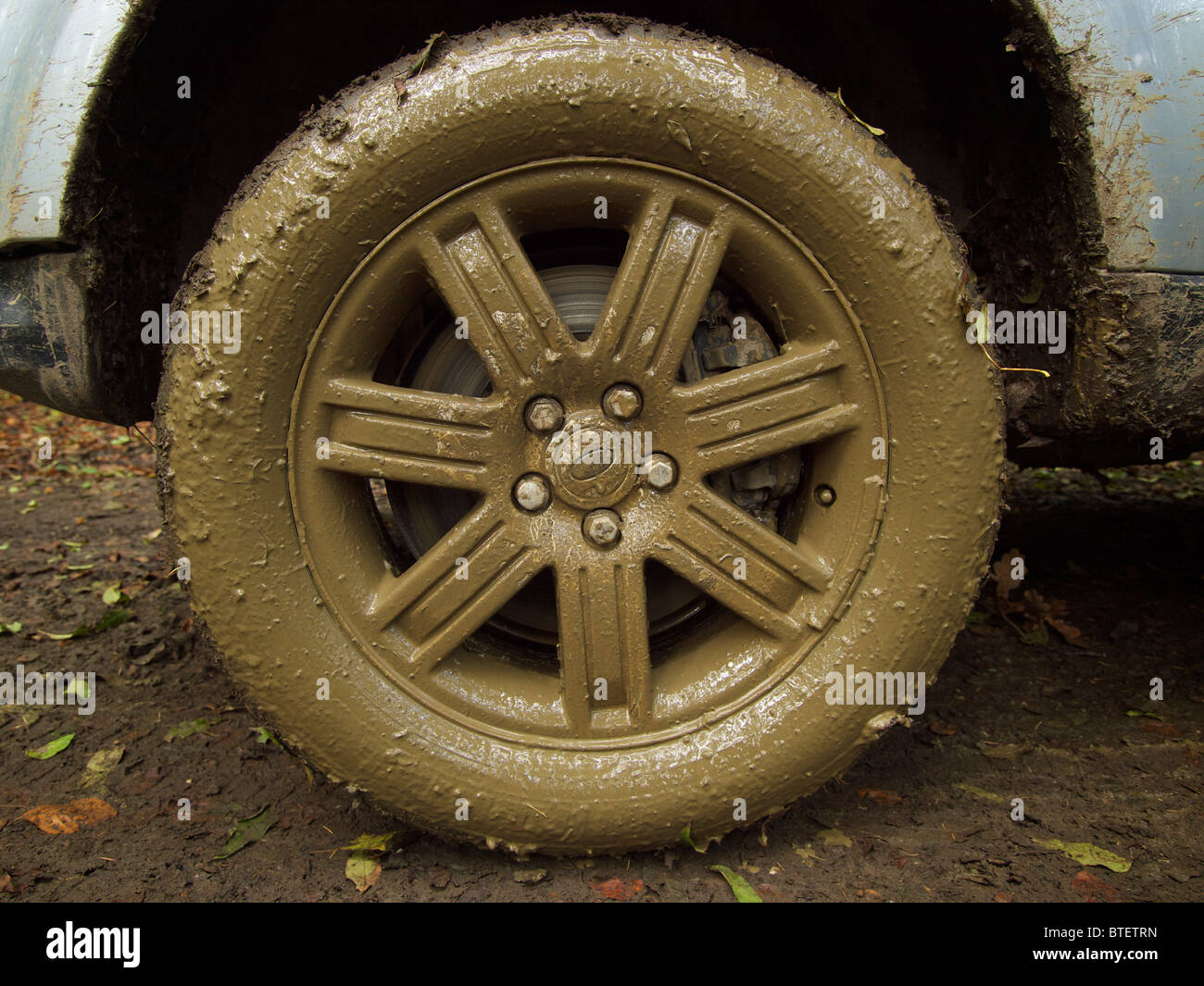 Very muddy wheel of a Range Rover Sport car after driving offroad Stock ...