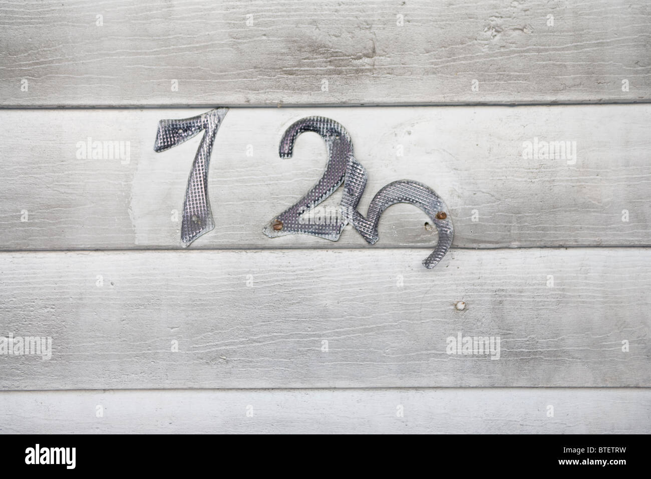 Broken house number Stock Photo - Alamy