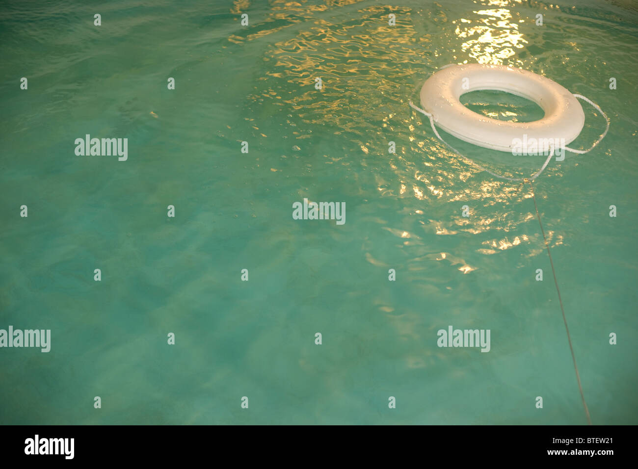 A life preserver floats in the swimming pool Stock Photo - Alamy