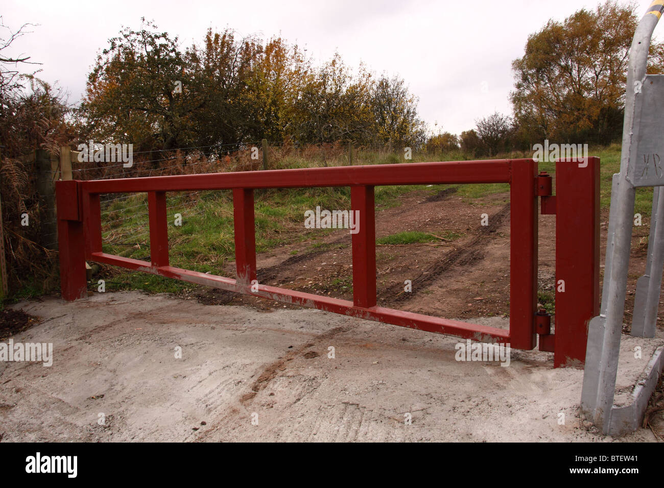 Farm security gate at the entrance to a nature reserve Stock Photo - Alamy