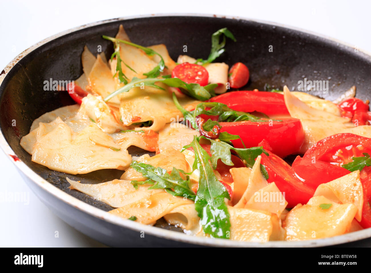 Preparing an appetizer on a frying pan Stock Photo - Alamy