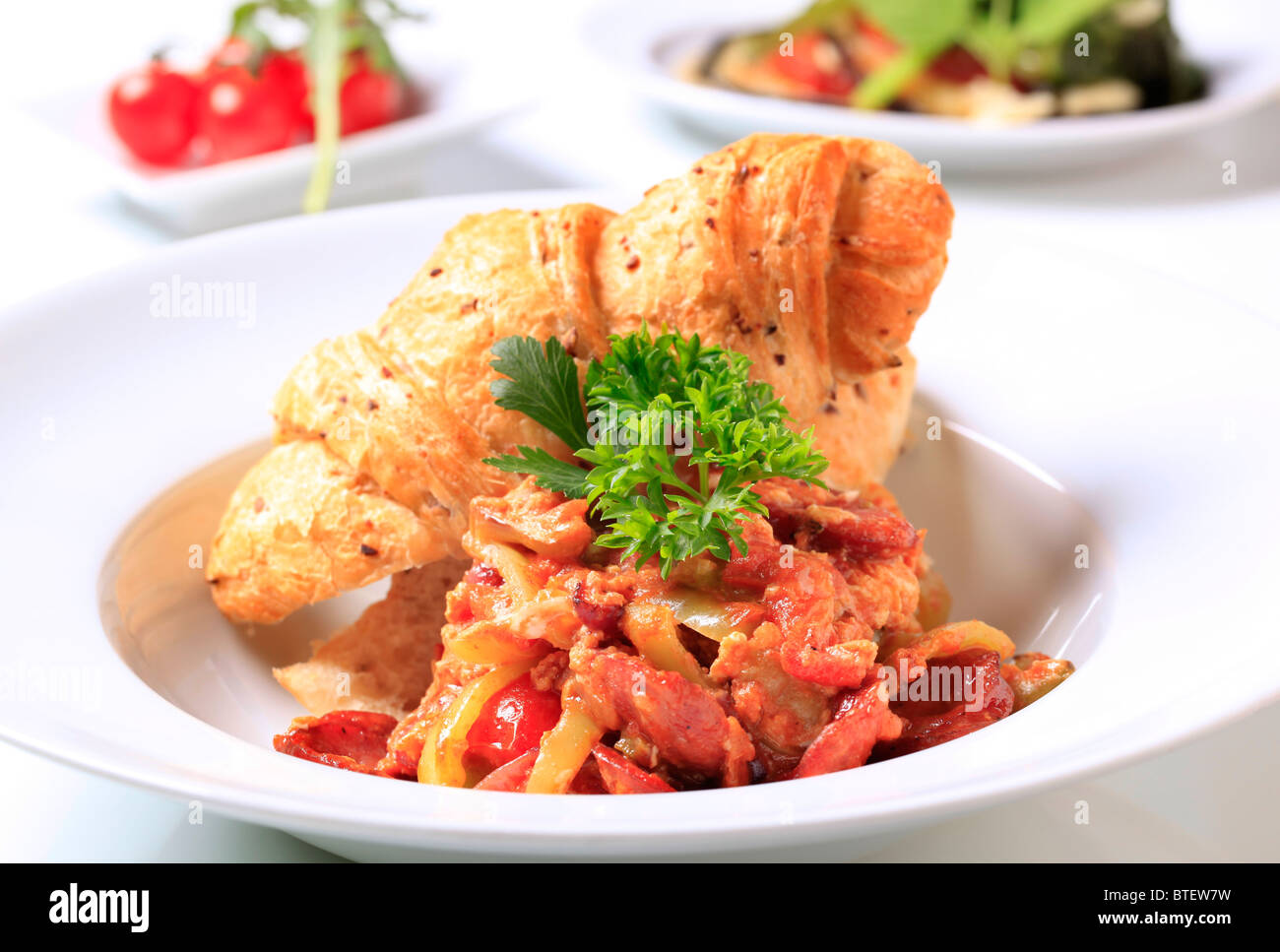 Hungarian Lesco served with whole wheat roll Stock Photo - Alamy