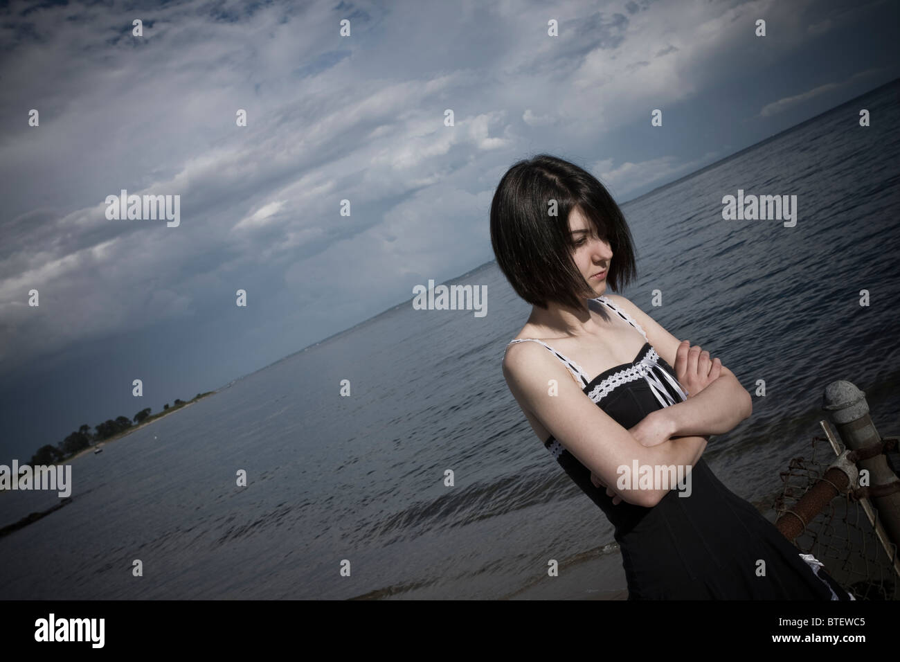 Woman standing ocean hi-res stock photography and images - Alamy