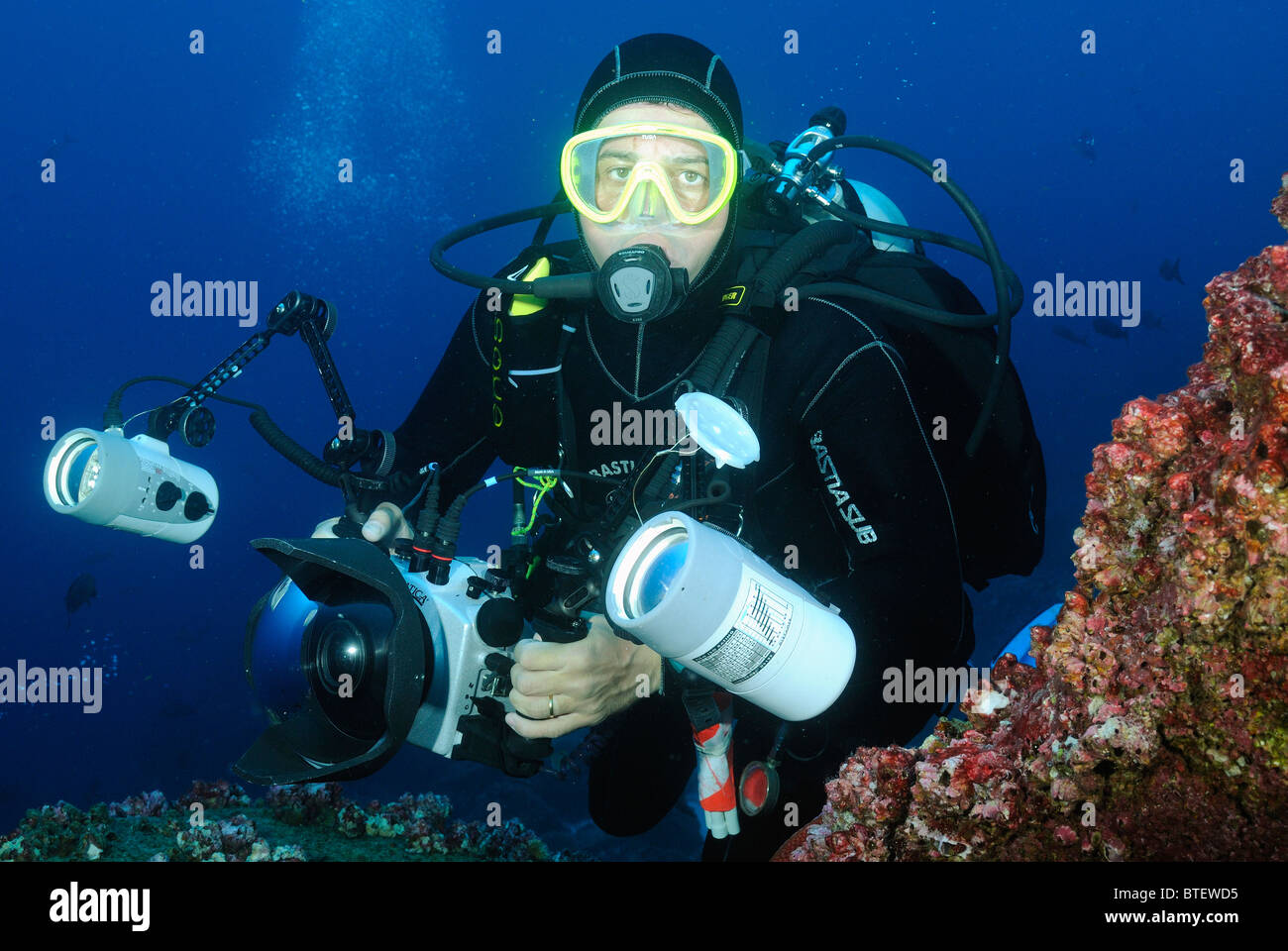 Man scuba diver holding his camera, Galapagos, Ecuador Stock Photo - Alamy