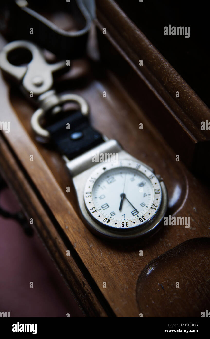 Metal pocket watch on wooden tray, Maricourt, Quebec Stock Photo - Alamy