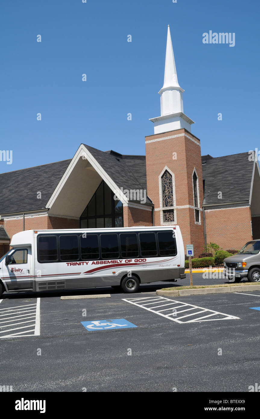 church bus in front of Trinity Assembly of God church in Lahnam ...