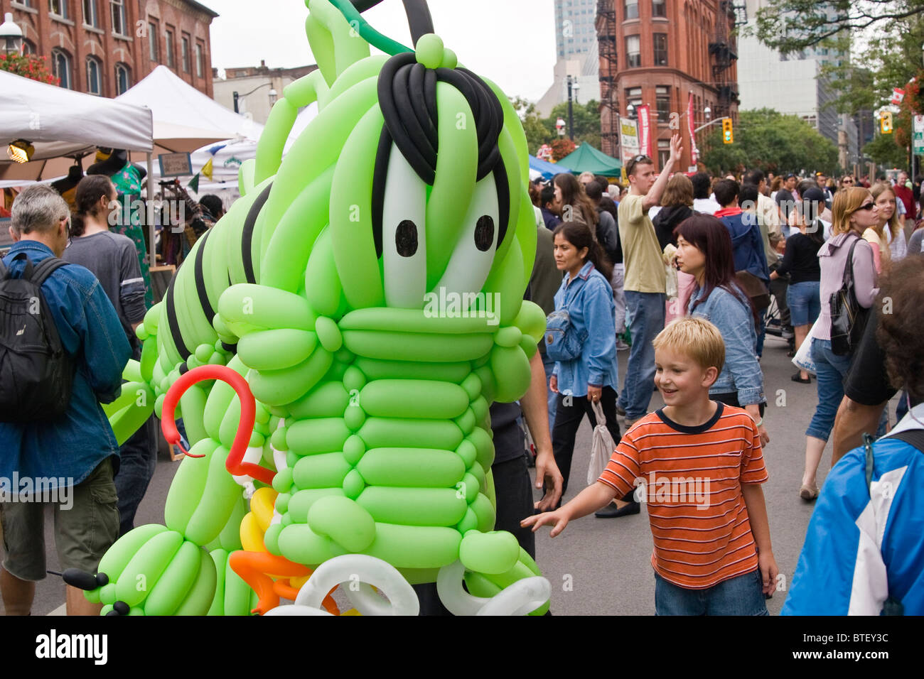 Toronto Buskerfest, balloon caterpillar Stock Photo - Alamy