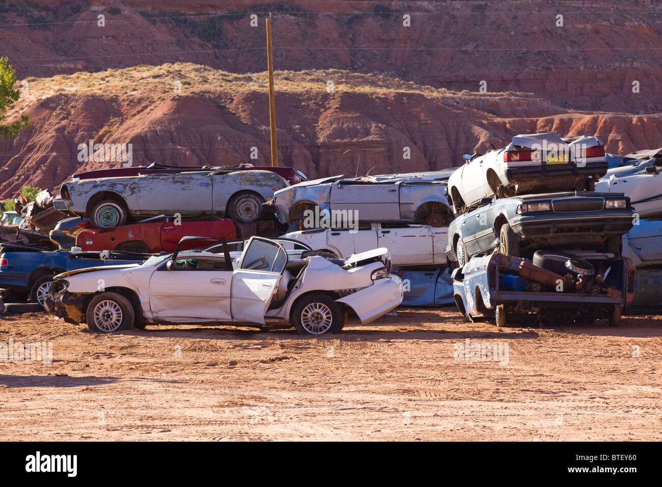 Crushed cars stacked in scrapheap Stock Photo - Alamy