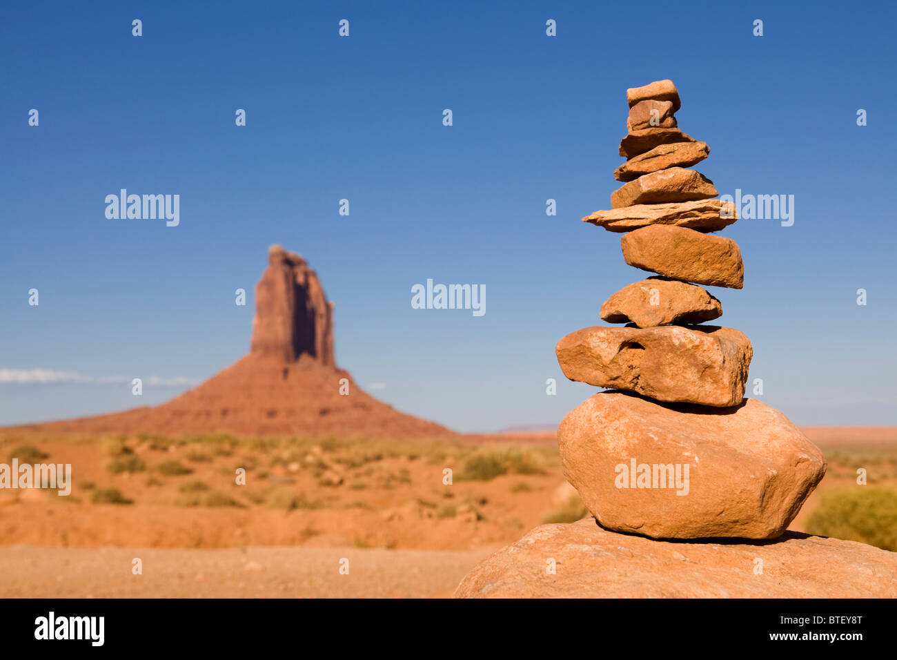 Stacked sedimentary rocks with Mesa rock formation in background - Utah ...