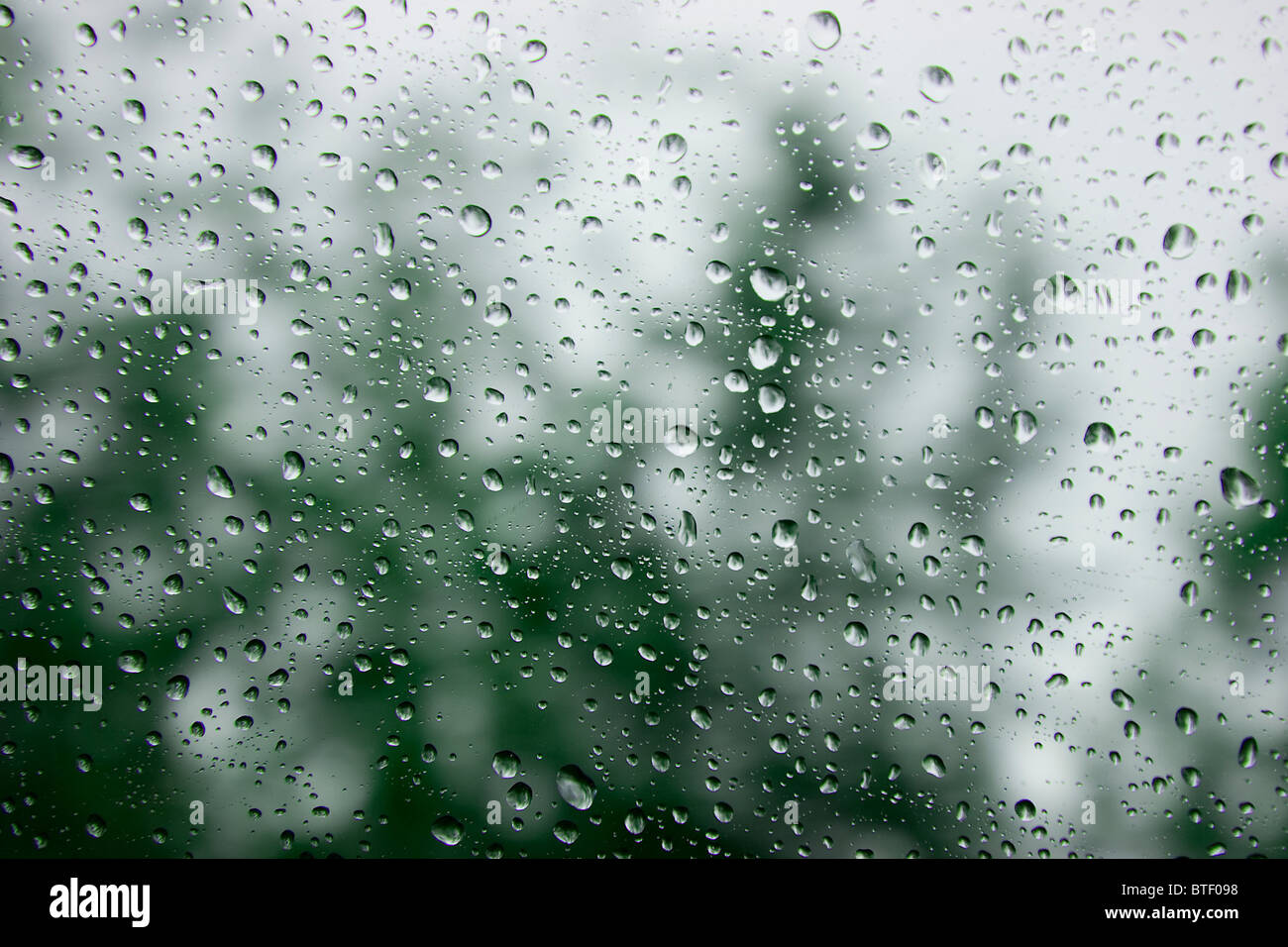 Photo of rain drops on transparent glass Stock Photo - Alamy