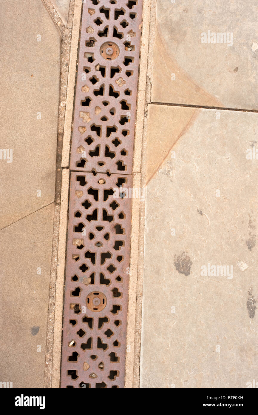 Ornate Ironwork Grille on Pavement Stock Photo - Alamy