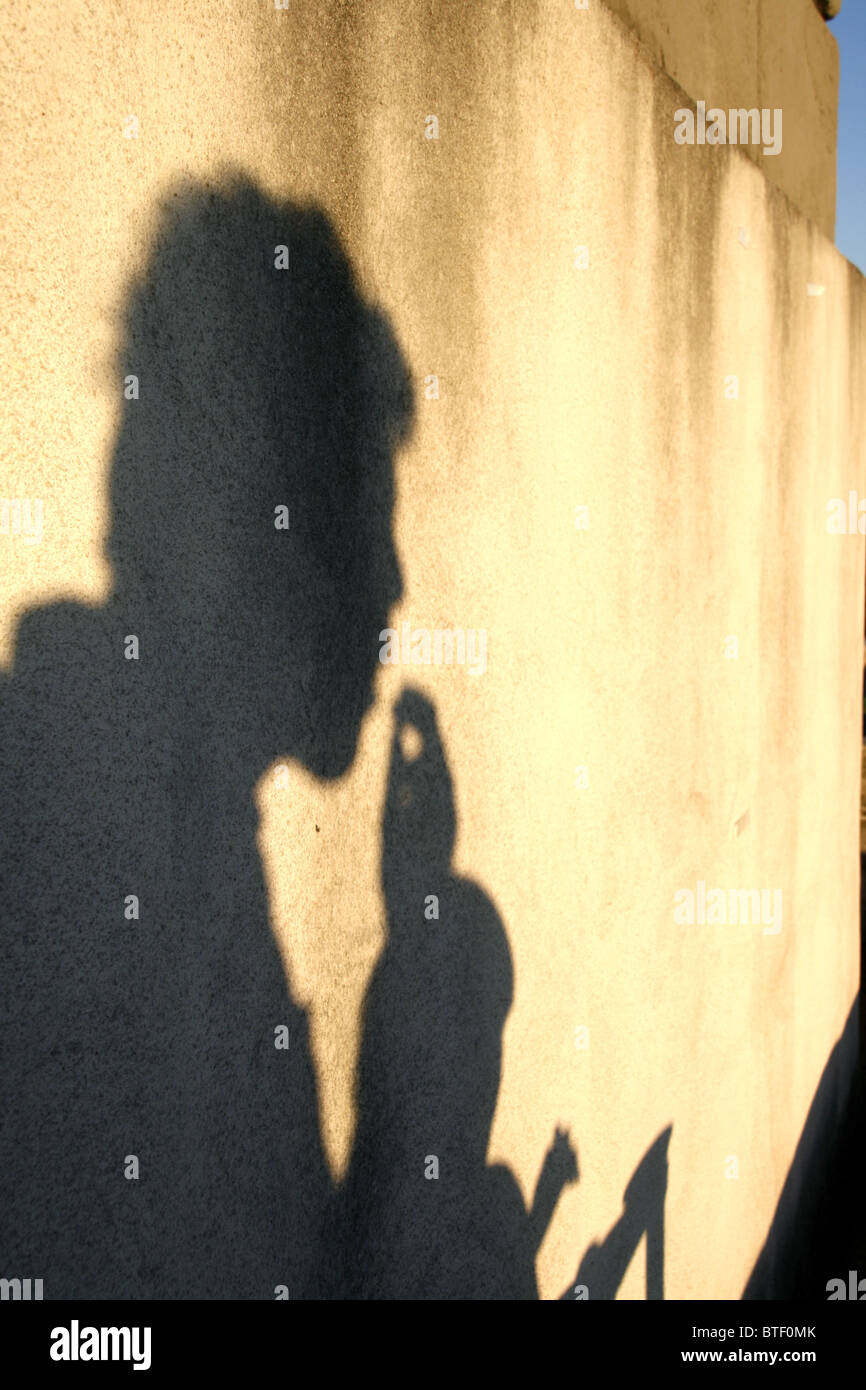 shadow of father and son on wall in sun Stock Photo - Alamy