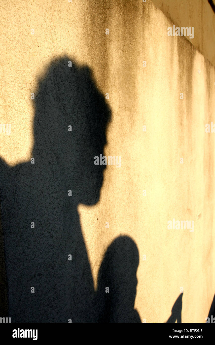 shadow of father and son on wall in sun Stock Photo - Alamy