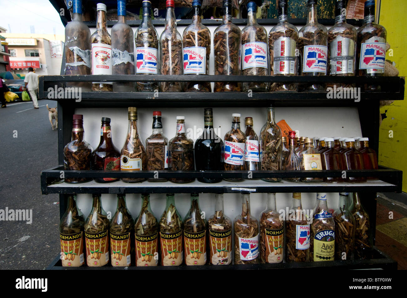 Bottles filled with tree bark and herbs soak in rum called Mama Juana ...