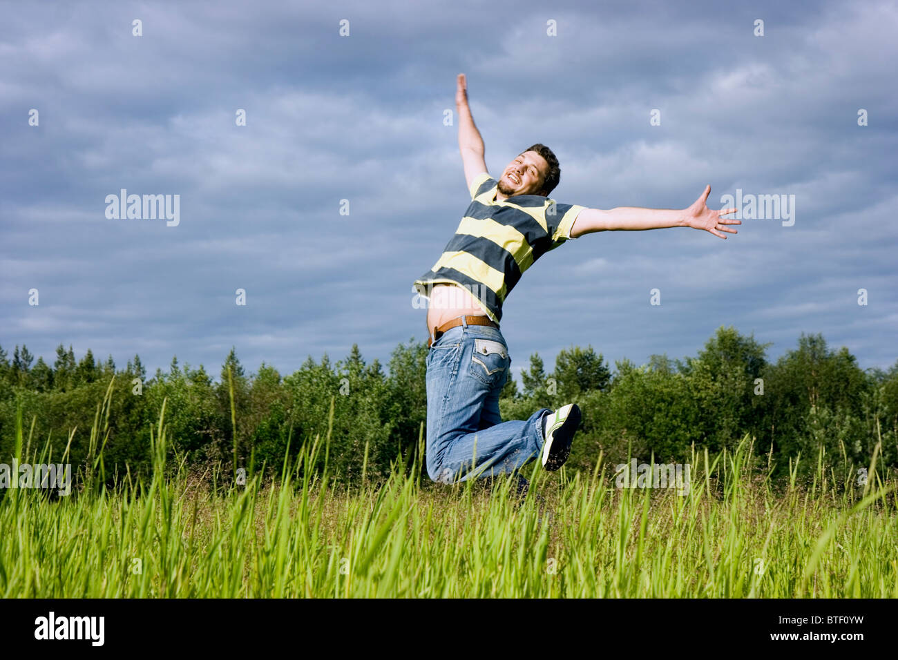 Man jumping joyfully in hi-res stock photography and images - Alamy