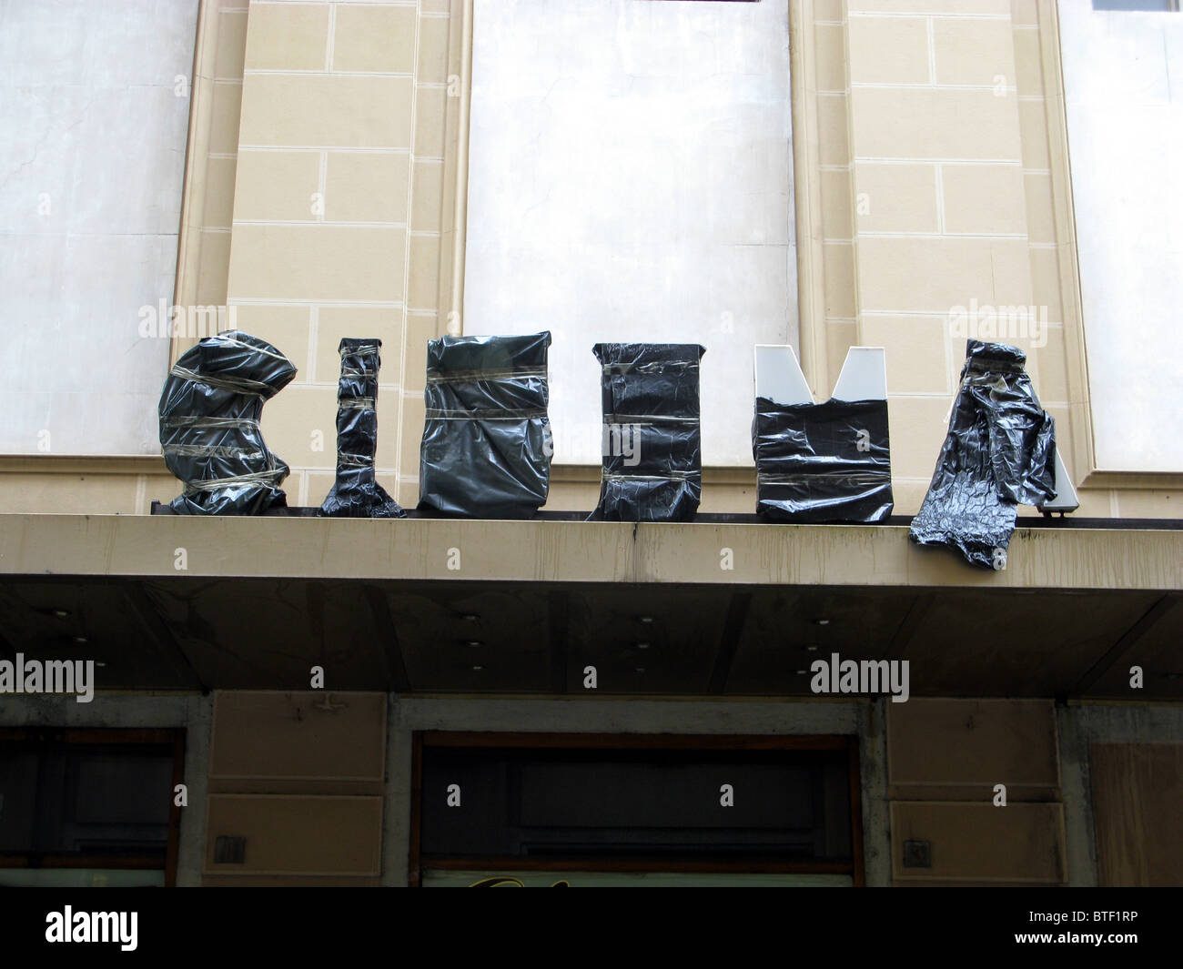 closed cinema with sign covered with black plastic sheets, italy Stock ...