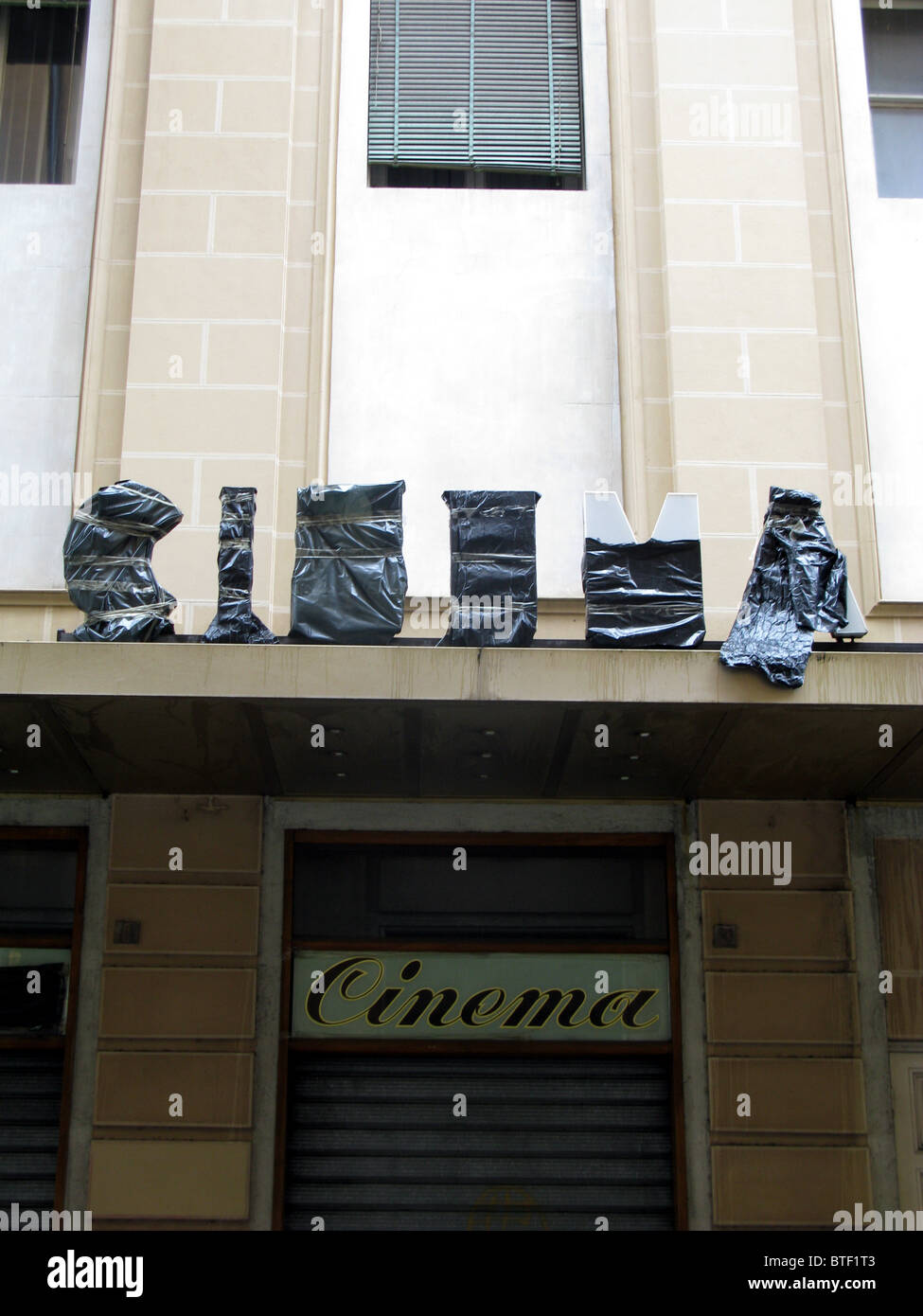 closed cinema with sign covered with black plastic sheets, italy Stock ...