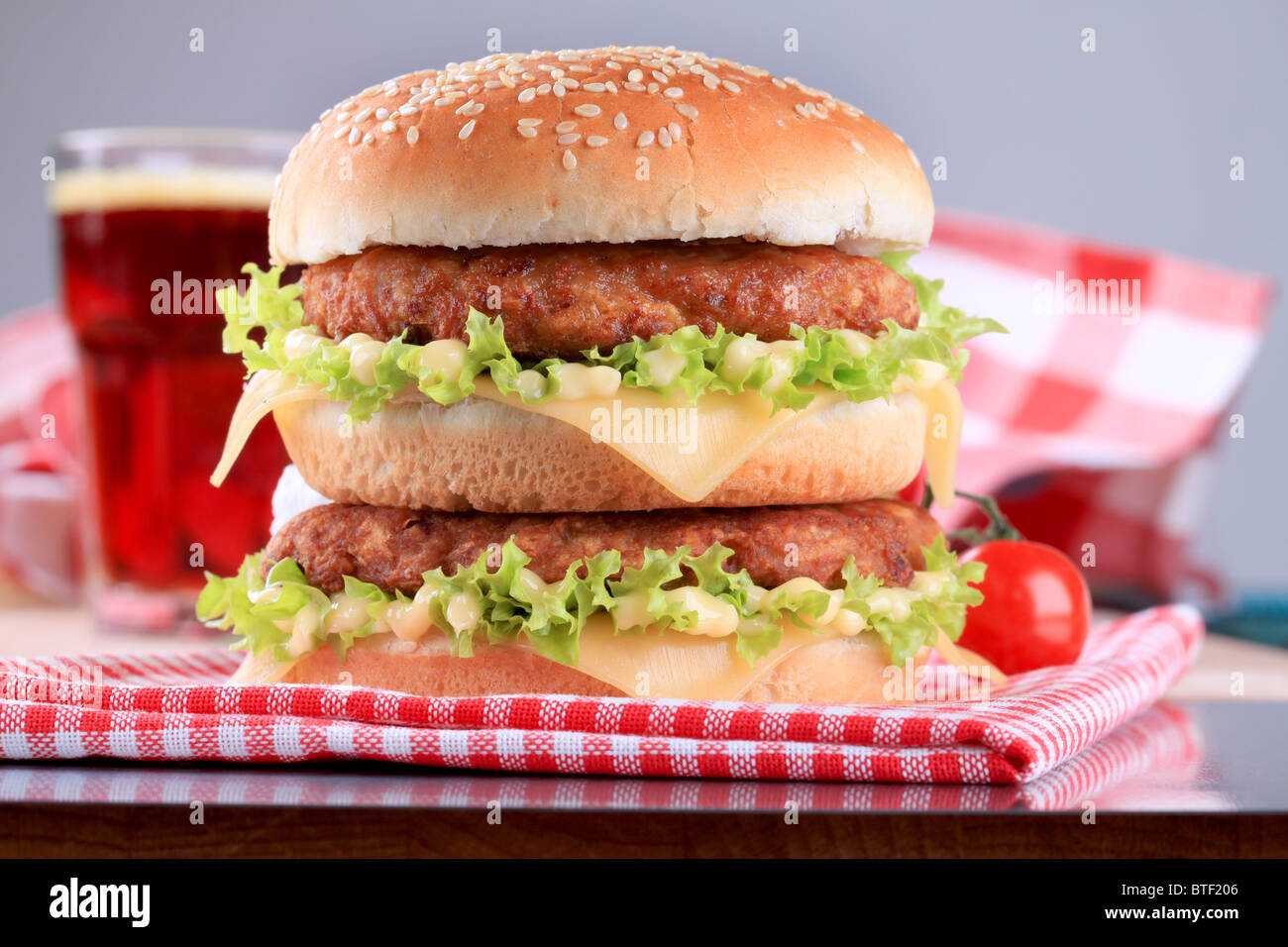 Appetizing double cheeseburger and glass of Cola Stock Photo - Alamy