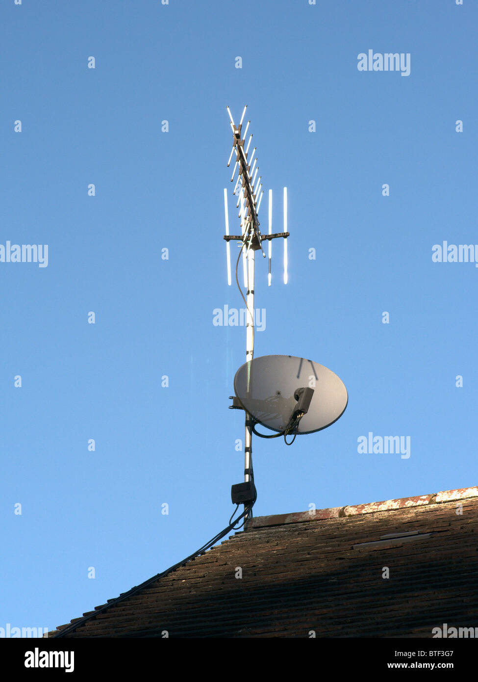 A satellite digital television arial on a roof Stock Photo - Alamy