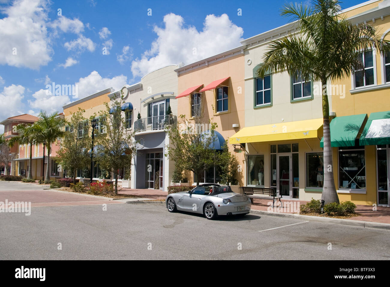 A shopping area with condos above stores that is designed to mimic a ...