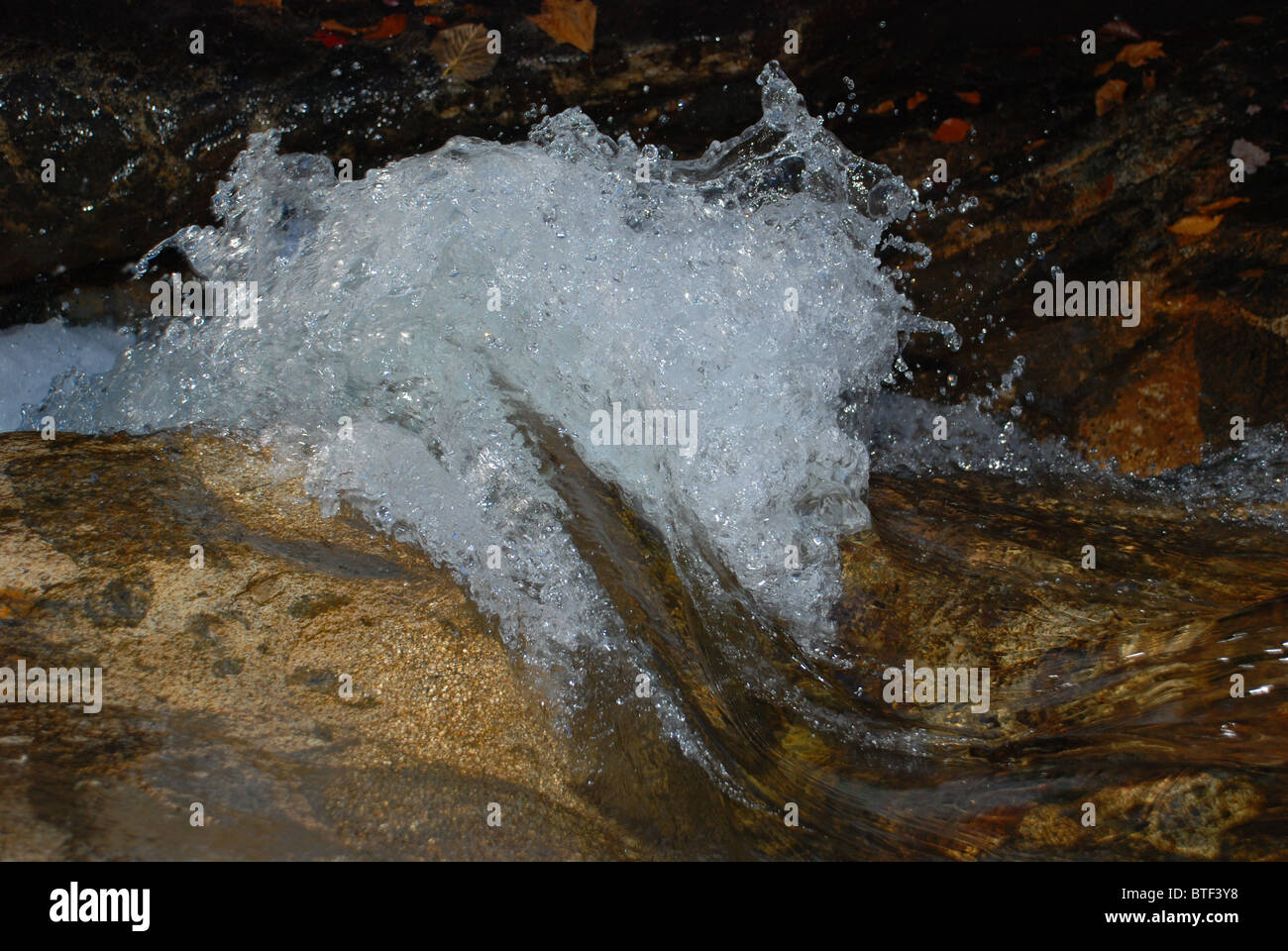 Water rushing over bed rock Stock Photo - Alamy