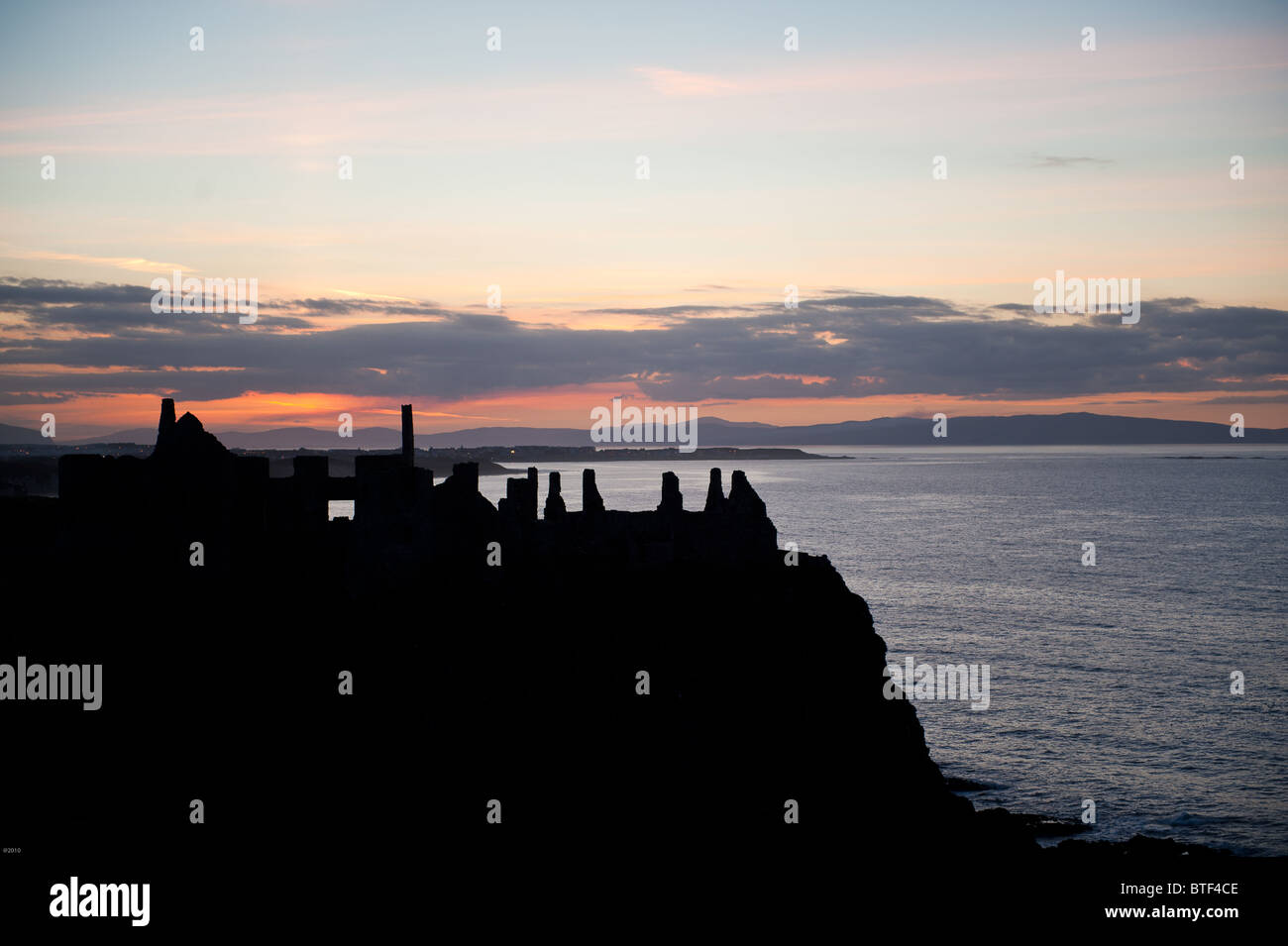 The ruins of Dunluce Castle at sunset Stock Photo - Alamy
