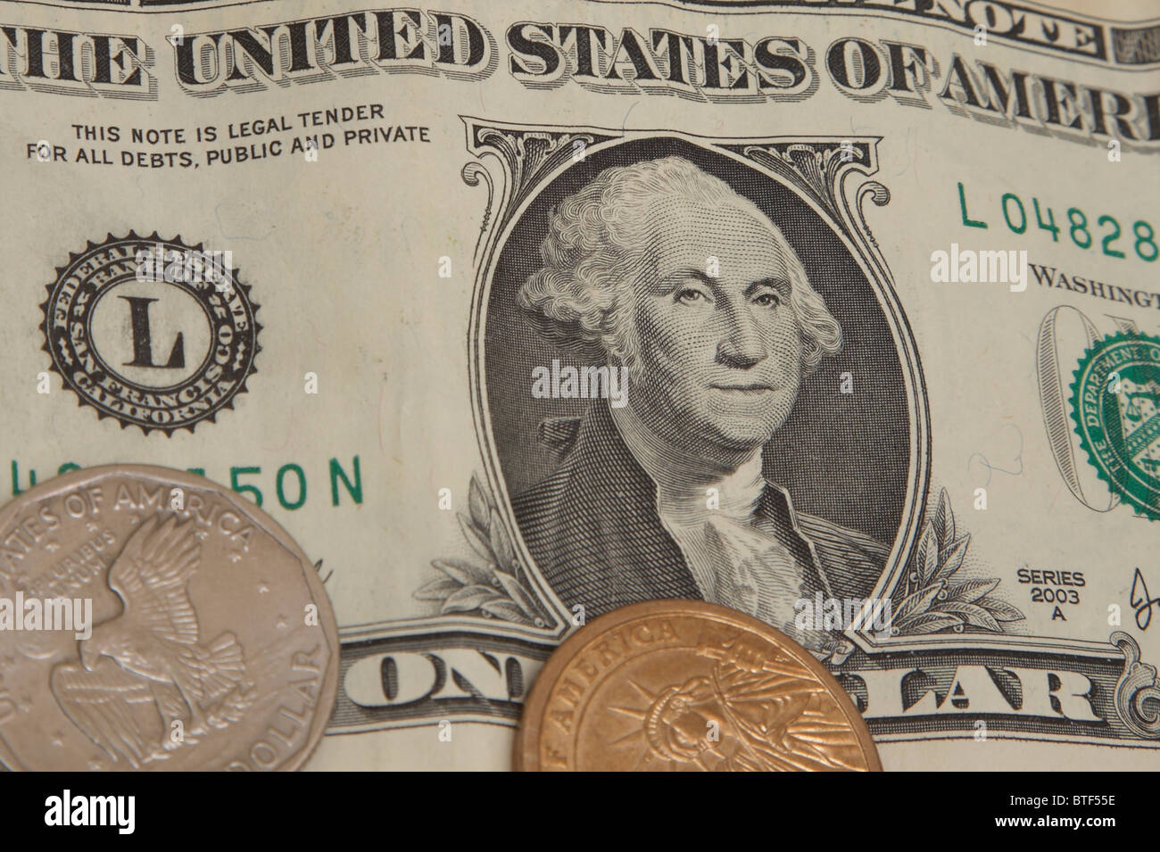 Dollar note and a Silver and Gold dollar coins Stock Photo - Alamy