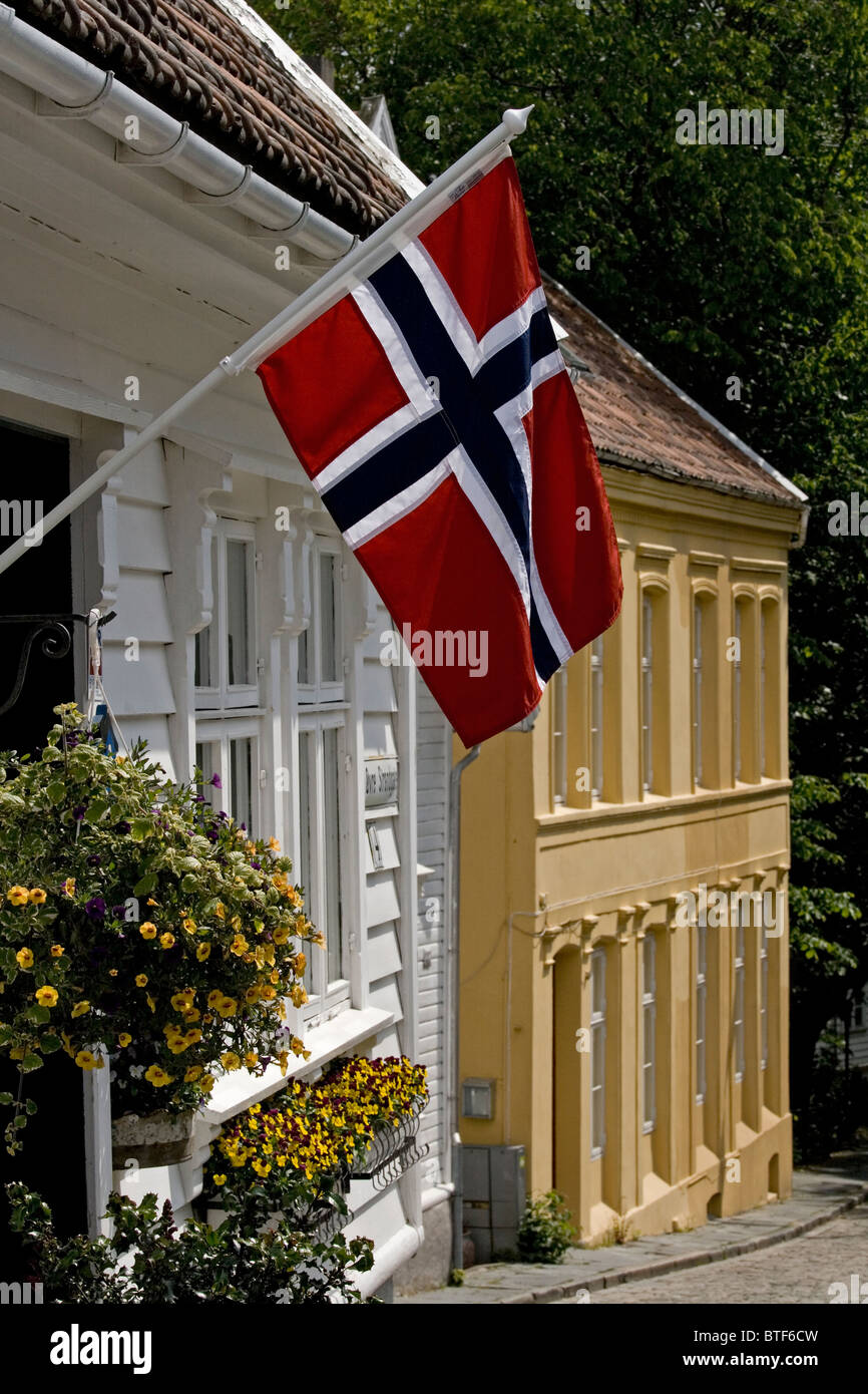 Norwegian flag outside a house in the historic old town quarter of ...
