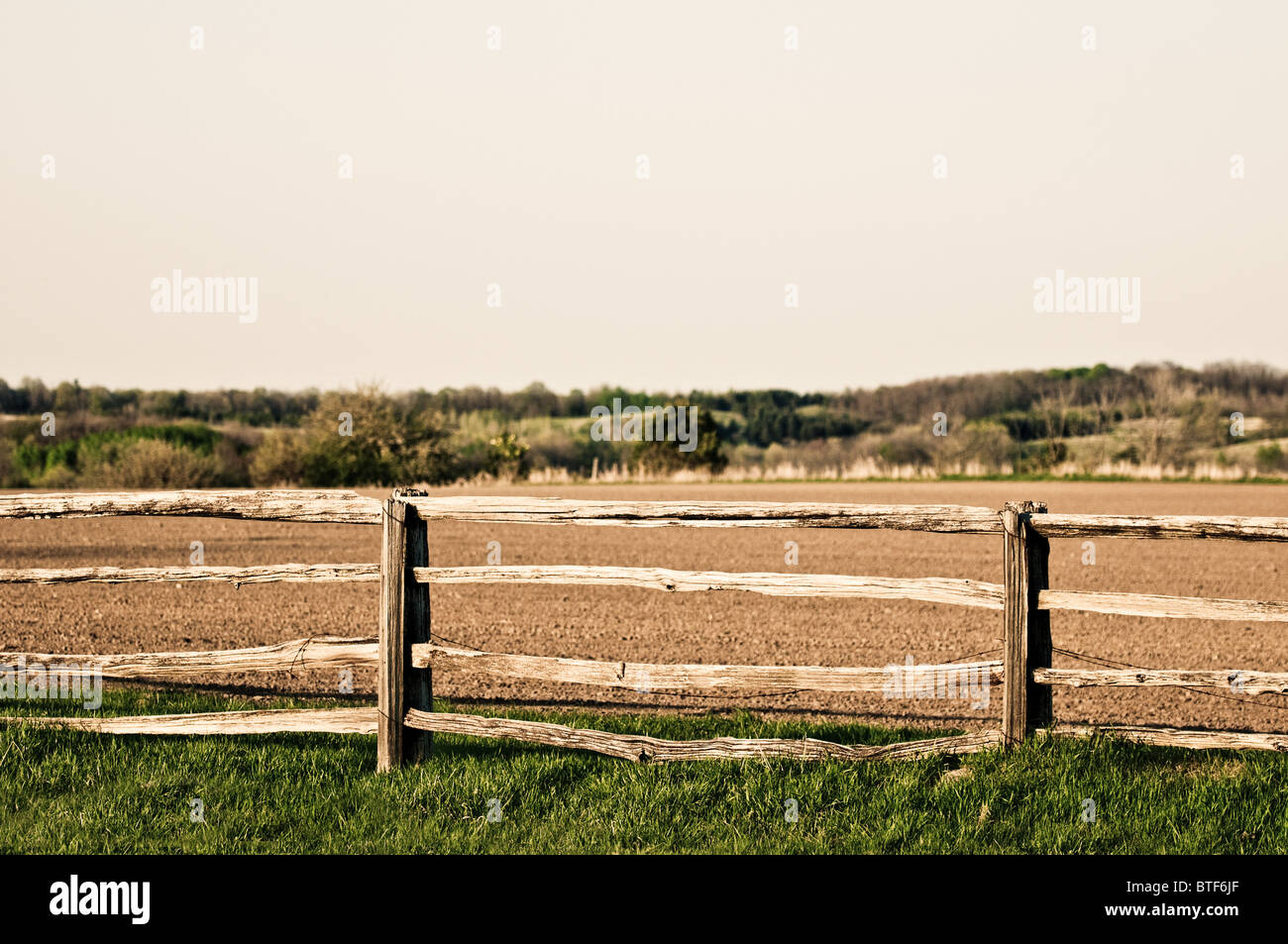 Fence on farm land Stock Photo - Alamy