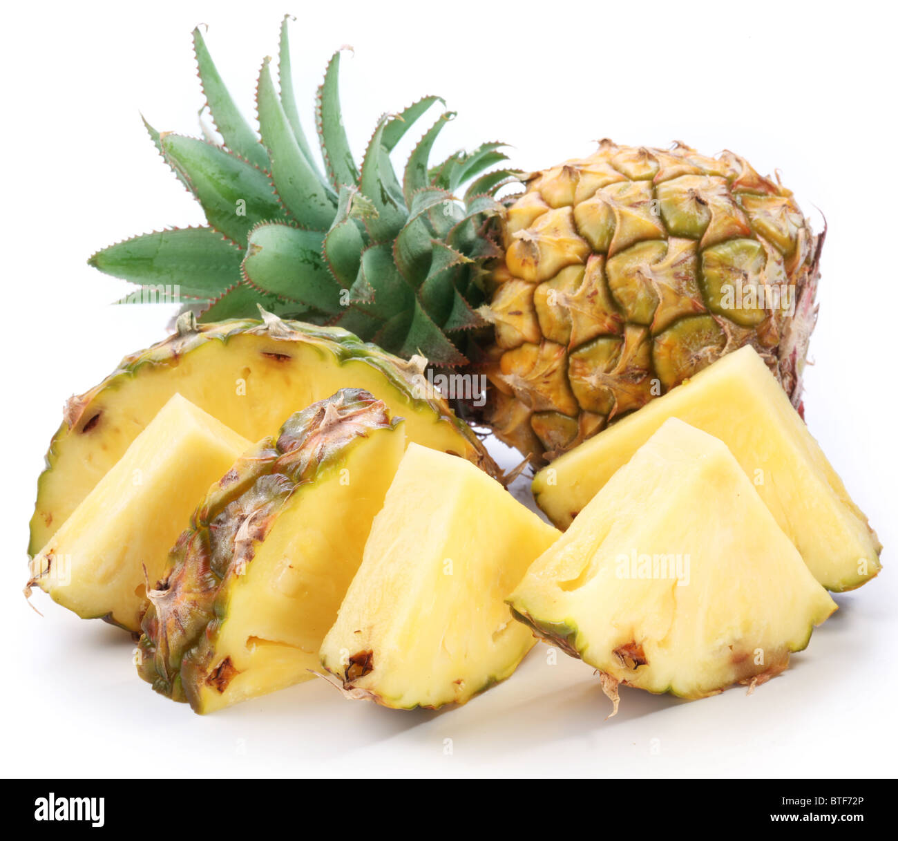 Cut ripe pineapple with rich green rosette. Isolated on a white Stock ...