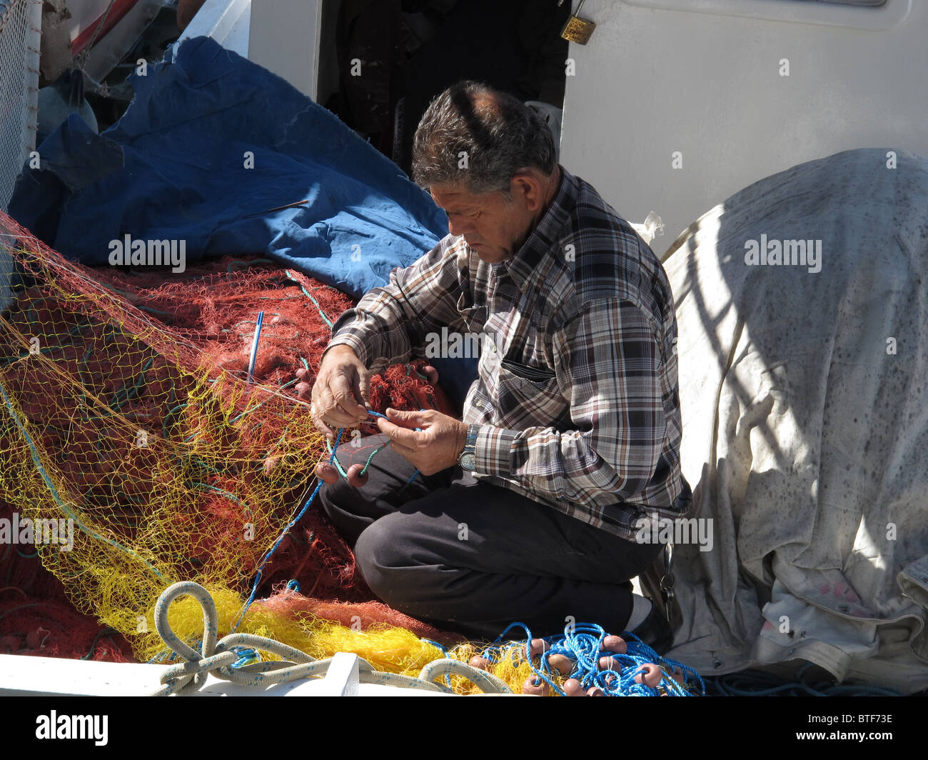 Fisherman working hi-res stock photography and images - Alamy