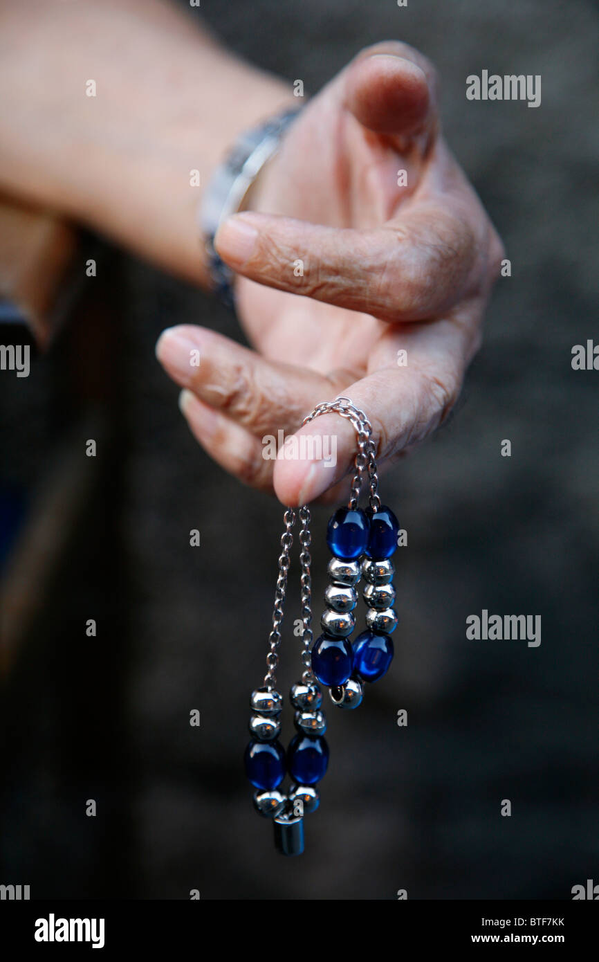 Hand holding worry beads, Rhodes, Greece Stock Photo - Alamy