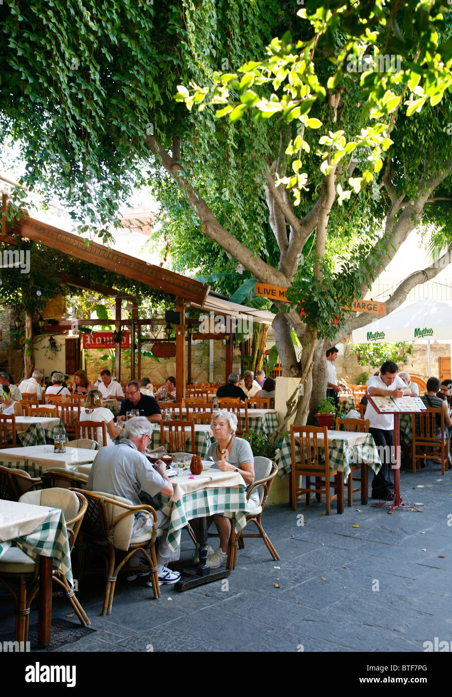 People sitting at a Taverna restaurant in Rhodes old Town, Rhodes ...