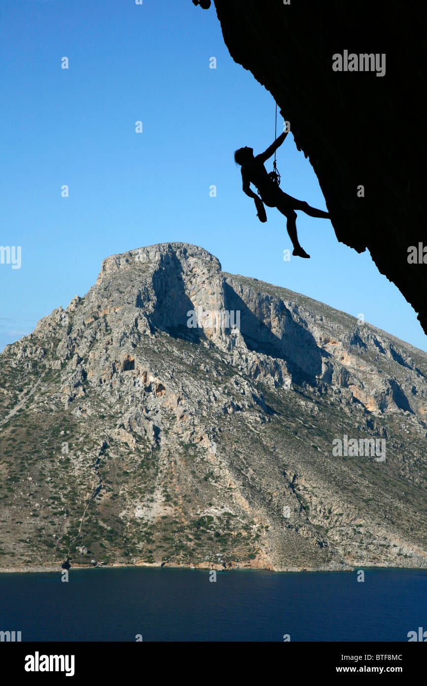Rock Climbing in in Grande Grotta Cave with the Telendos Island in the ...