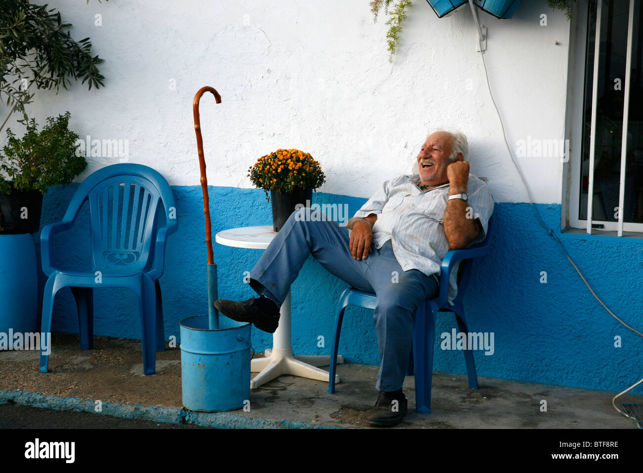 Man sitting by his house in Vathys or Vathis, Kalymnos, Greece Stock ...