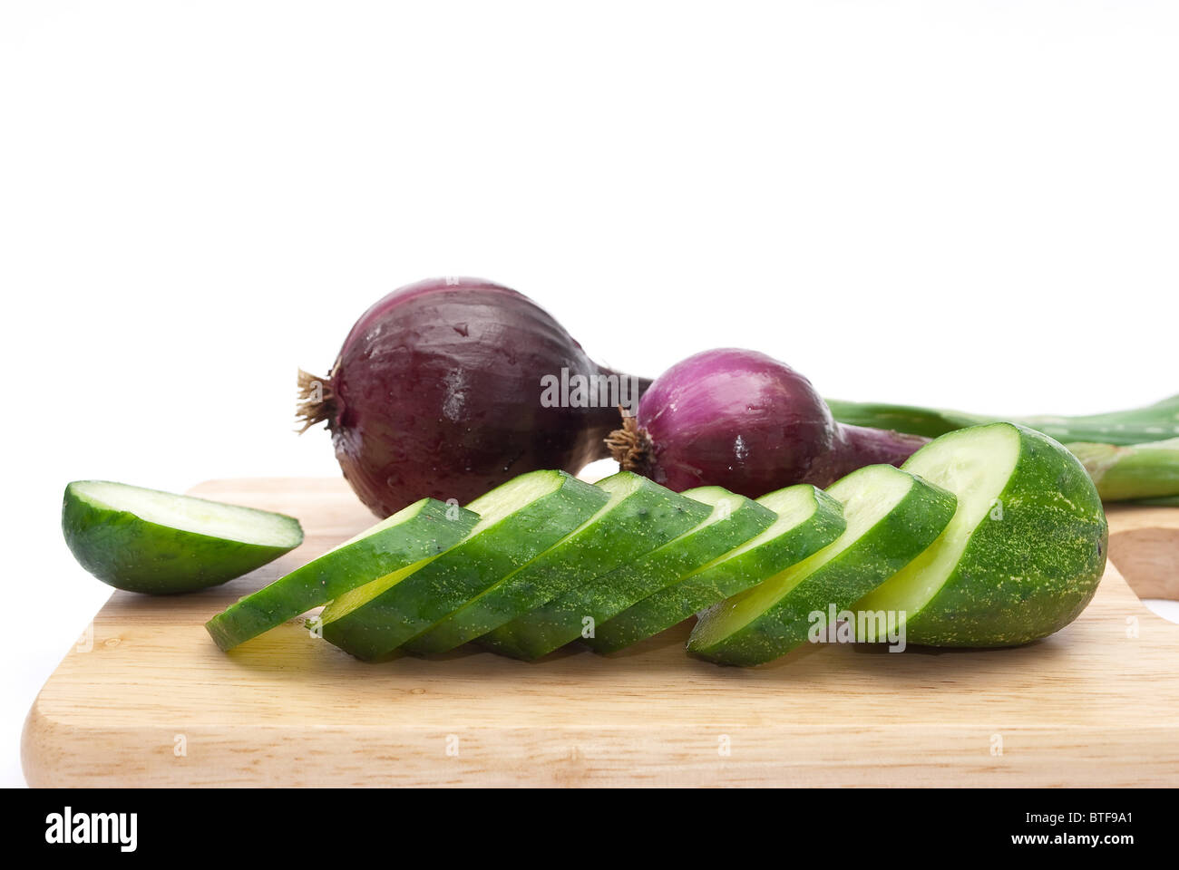 Green cucumber slices with red onion Stock Photo - Alamy