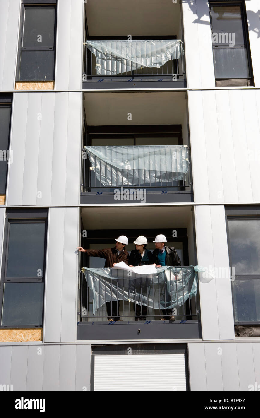 Property developer meeting with business people at building under ...