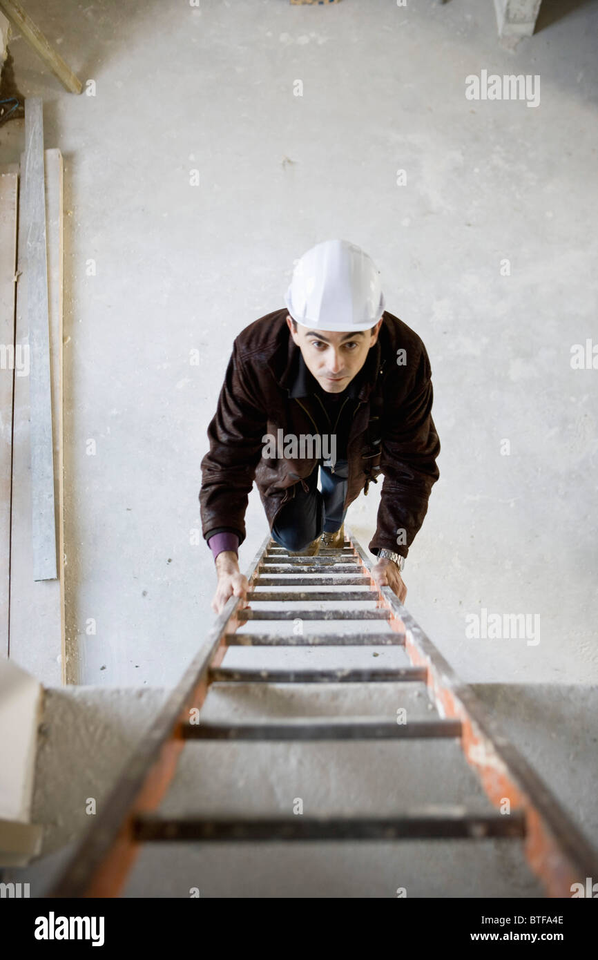 Construction worker climbing ladder hi-res stock photography and images ...