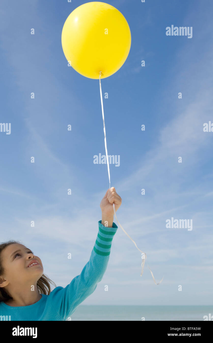Holding String Of Balloon High Resolution Stock Photography and Images ...