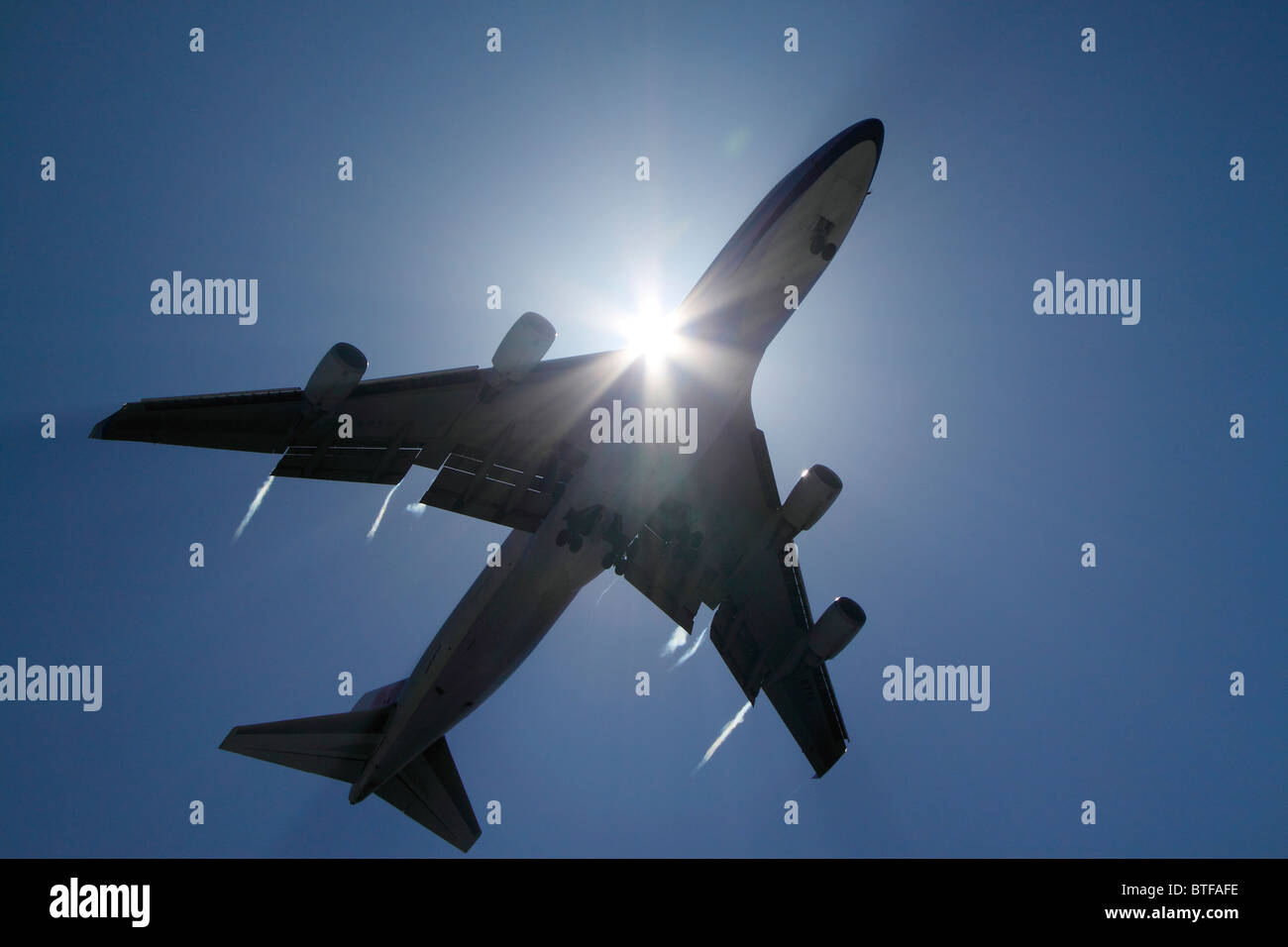 Boeing 747 aircraft in the clear blue sky on approach for landing, with ...