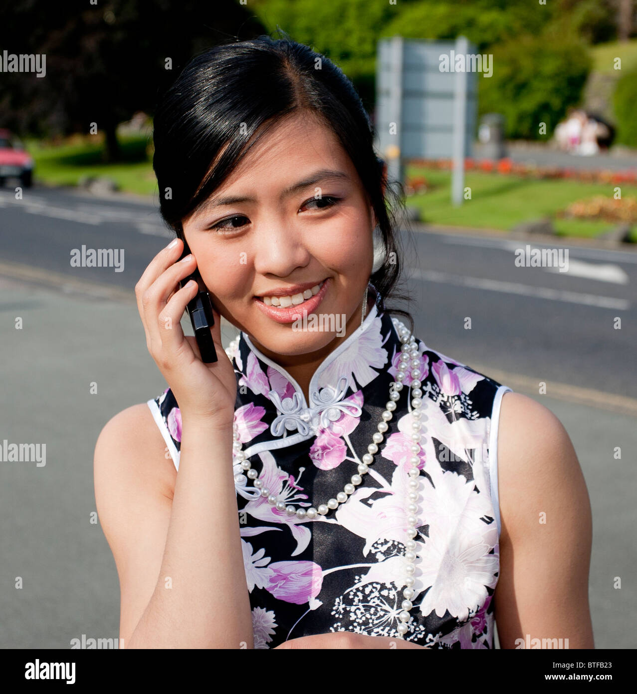 Hong Chinese girl - woman on mobile phone Stock Photo - Alamy