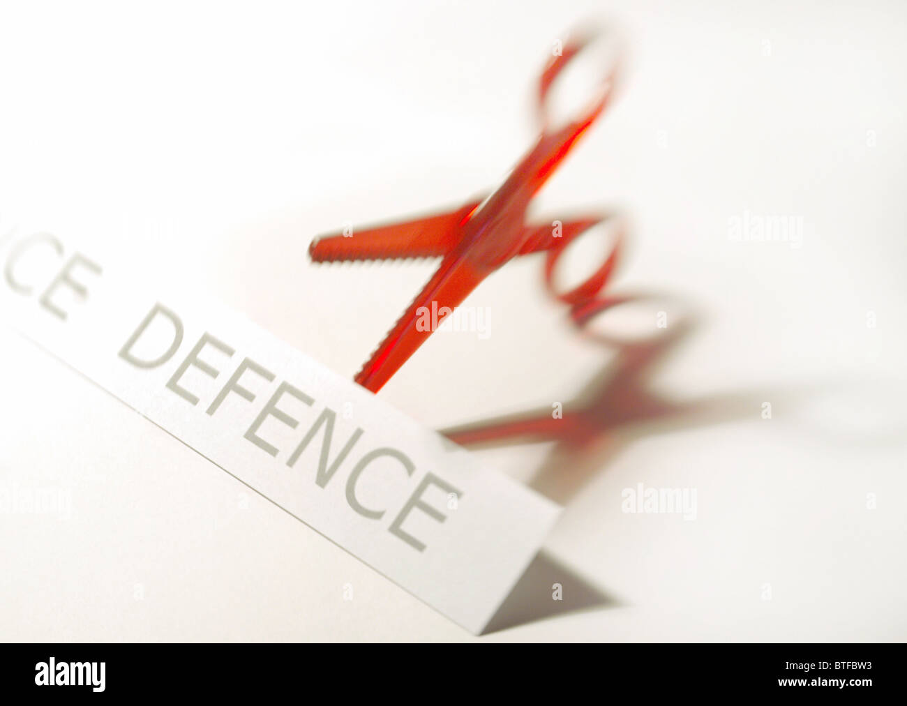 Defence cuts concept depicting red scissors and defence graphic Stock ...