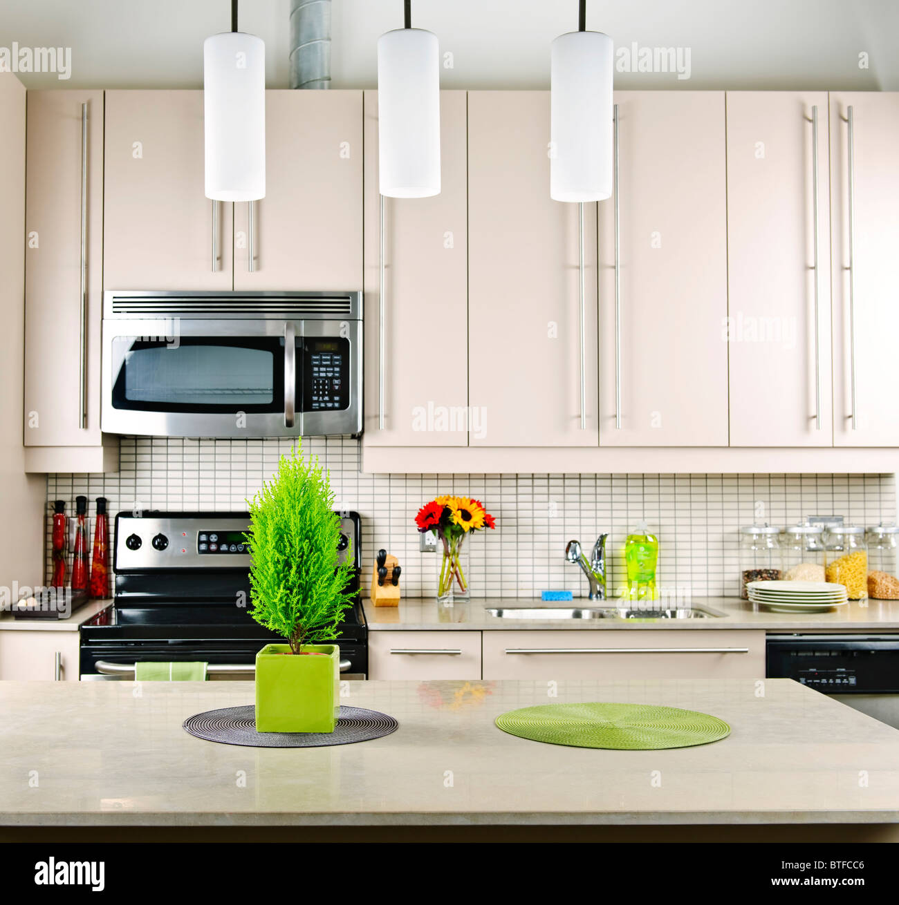 Modern kitchen interior with natural stone countertop Stock Photo - Alamy