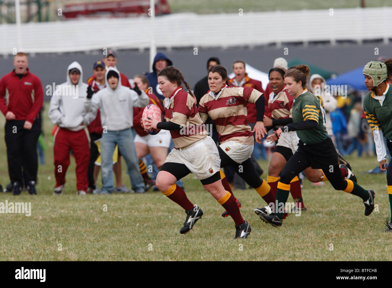 A Norwich University player races down field during a women's rugby ...