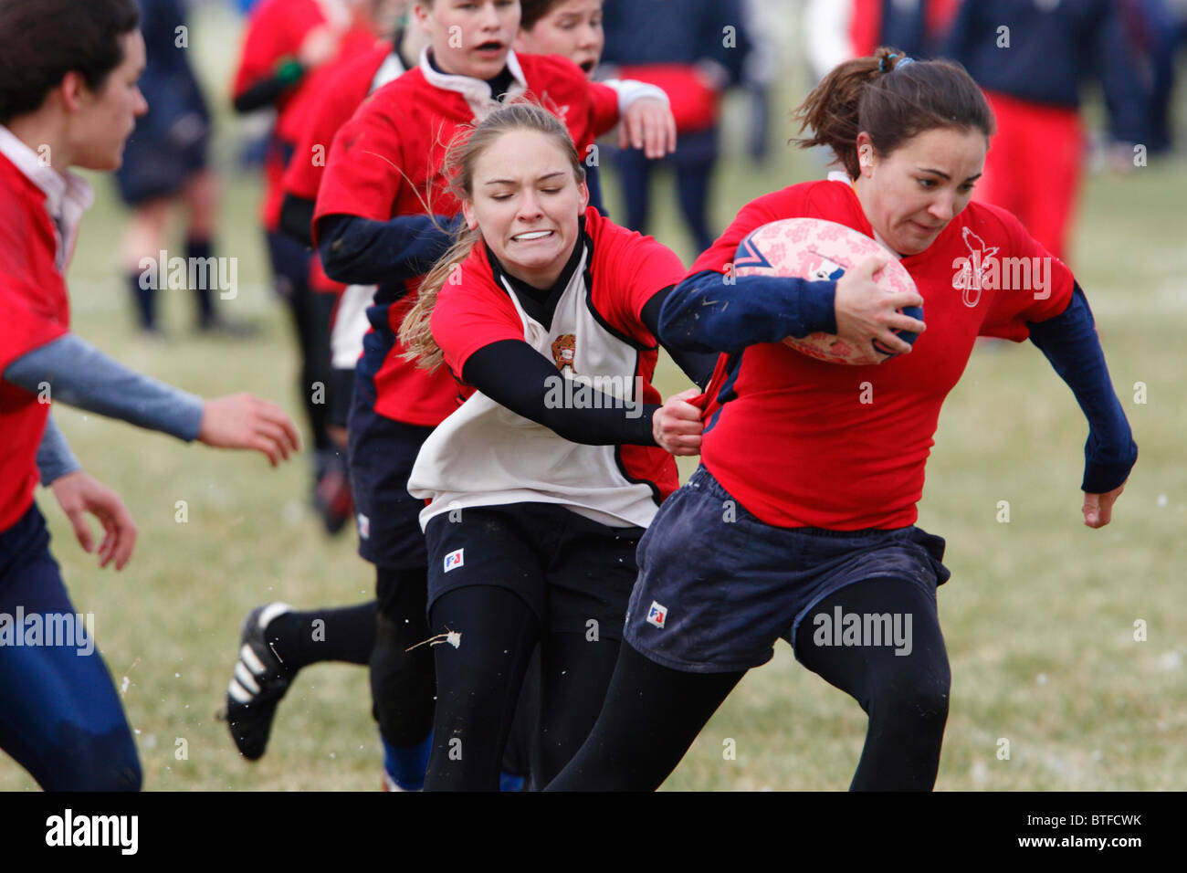 A University of Maryland player tries to tackle an American University ...