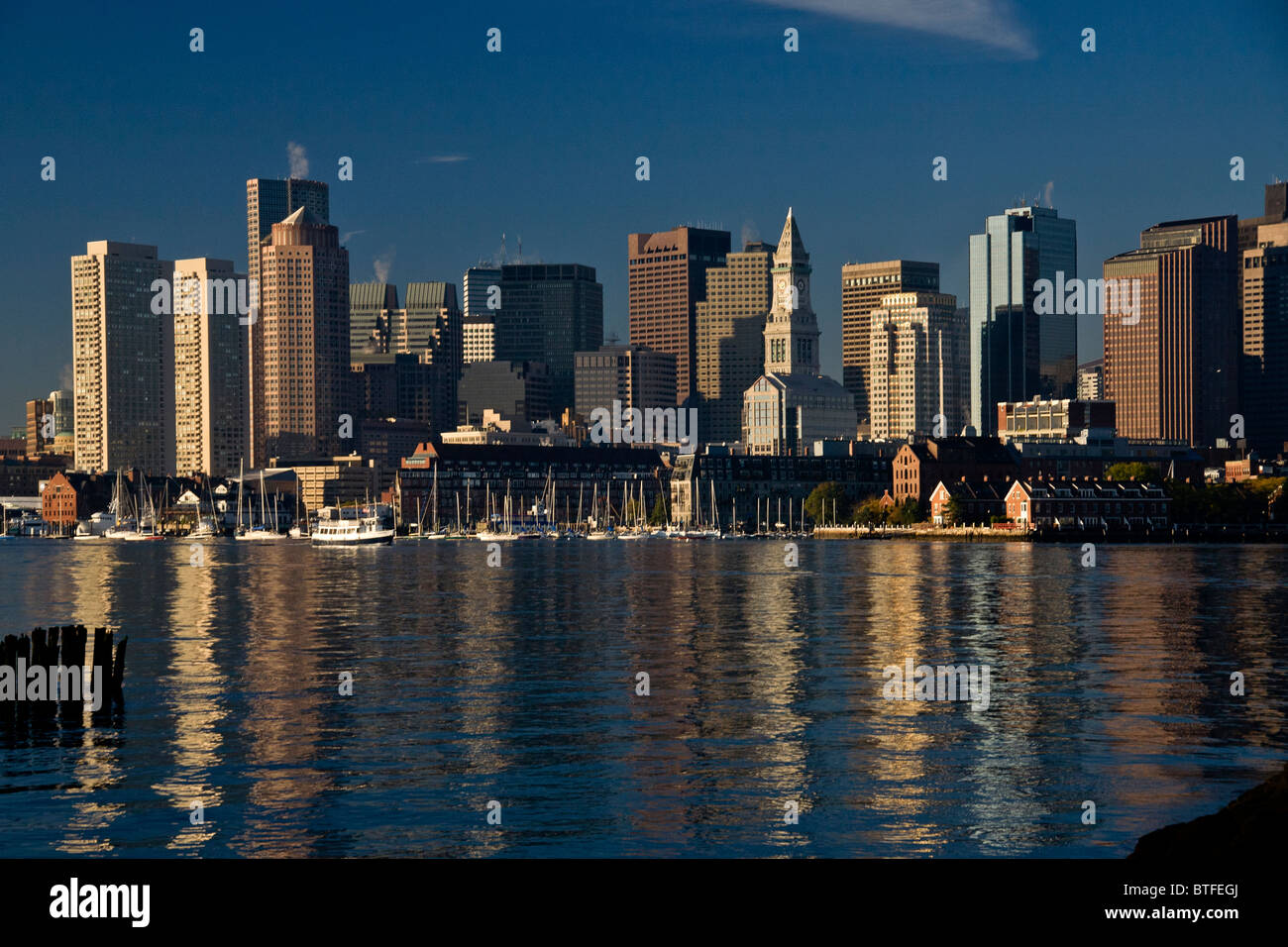 Morning sun shines on the downtown Boston harbor skyline as seen from ...